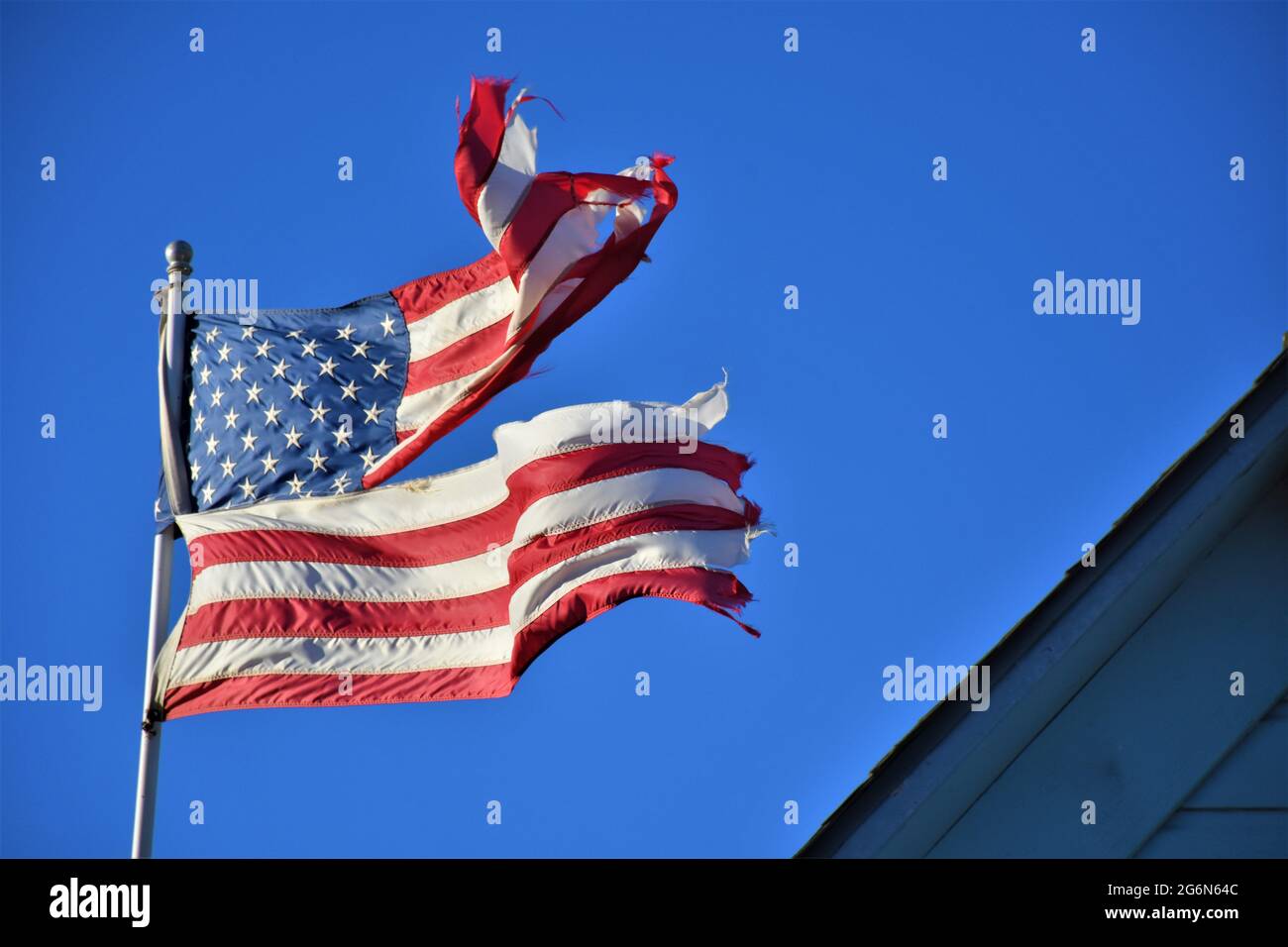 Torn american flag waving in hi-res stock photography and images - Alamy