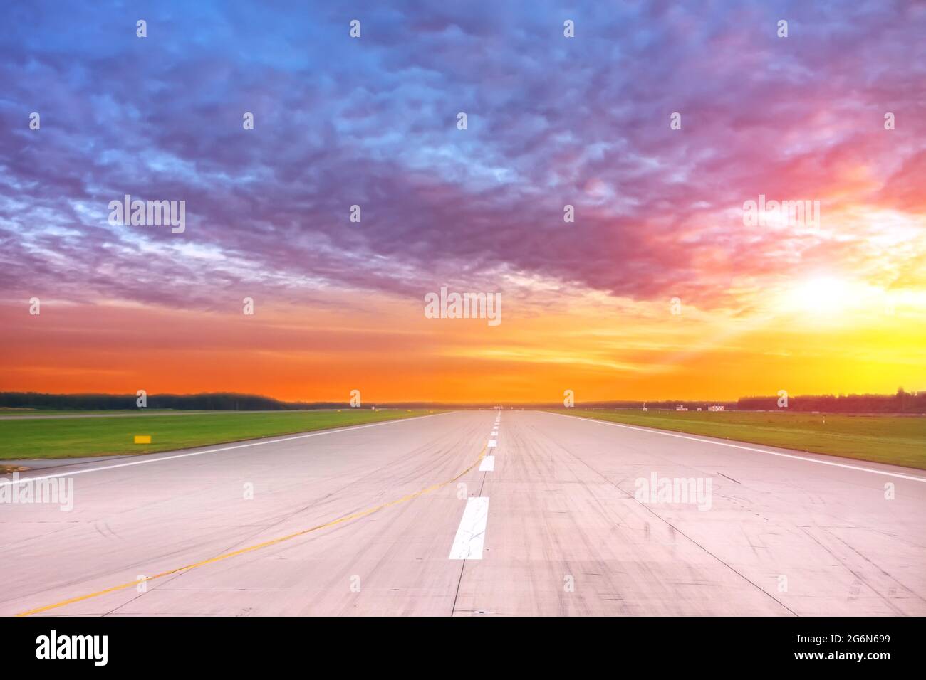Empty runway with evening dawn sunset bright sky Stock Photo - Alamy