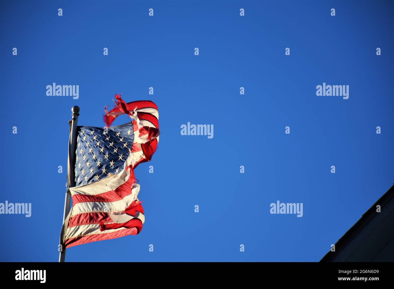 The wind has destroyed this American flag and needs to be replaced ...