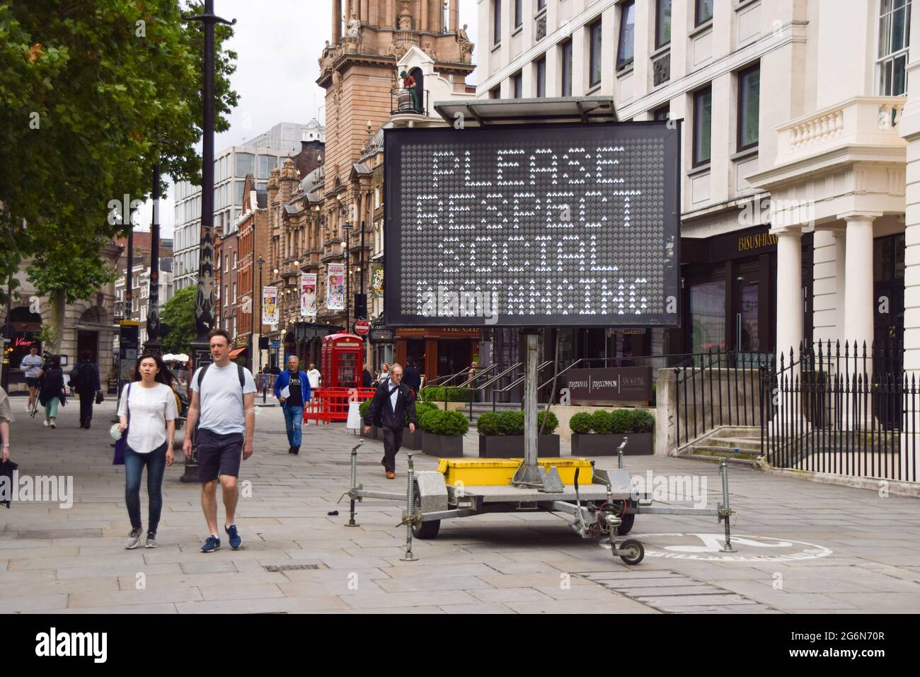 Please Respect Social Distancing sign seen at Trafalgar Square, where ...