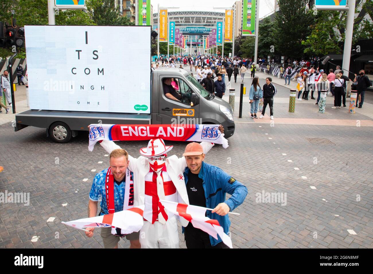 EDITORIAL USE ONLY England fans gather in front of a new billboard ...