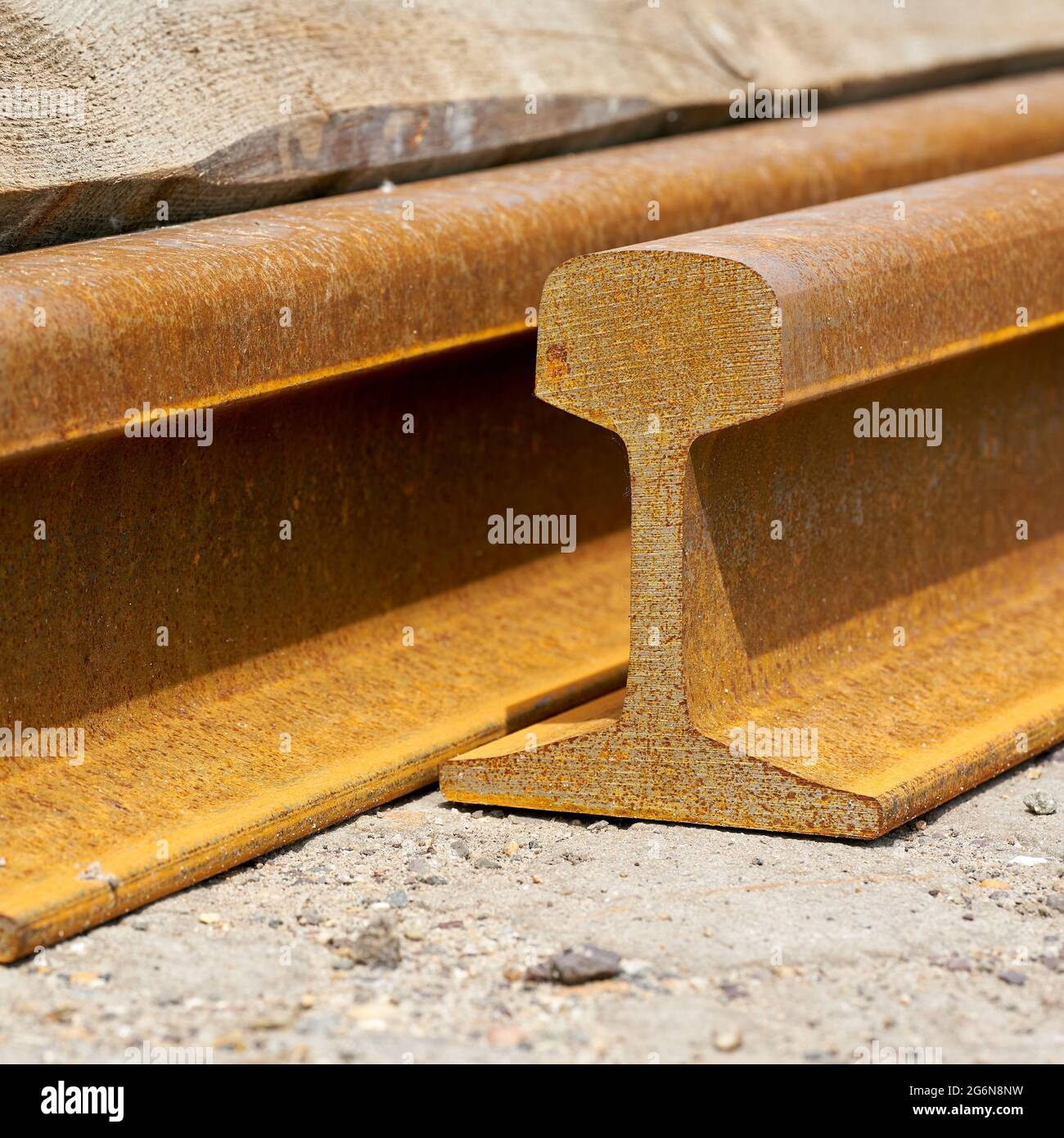 Close up of the cross section of a rusty railroad rail in a storage ...