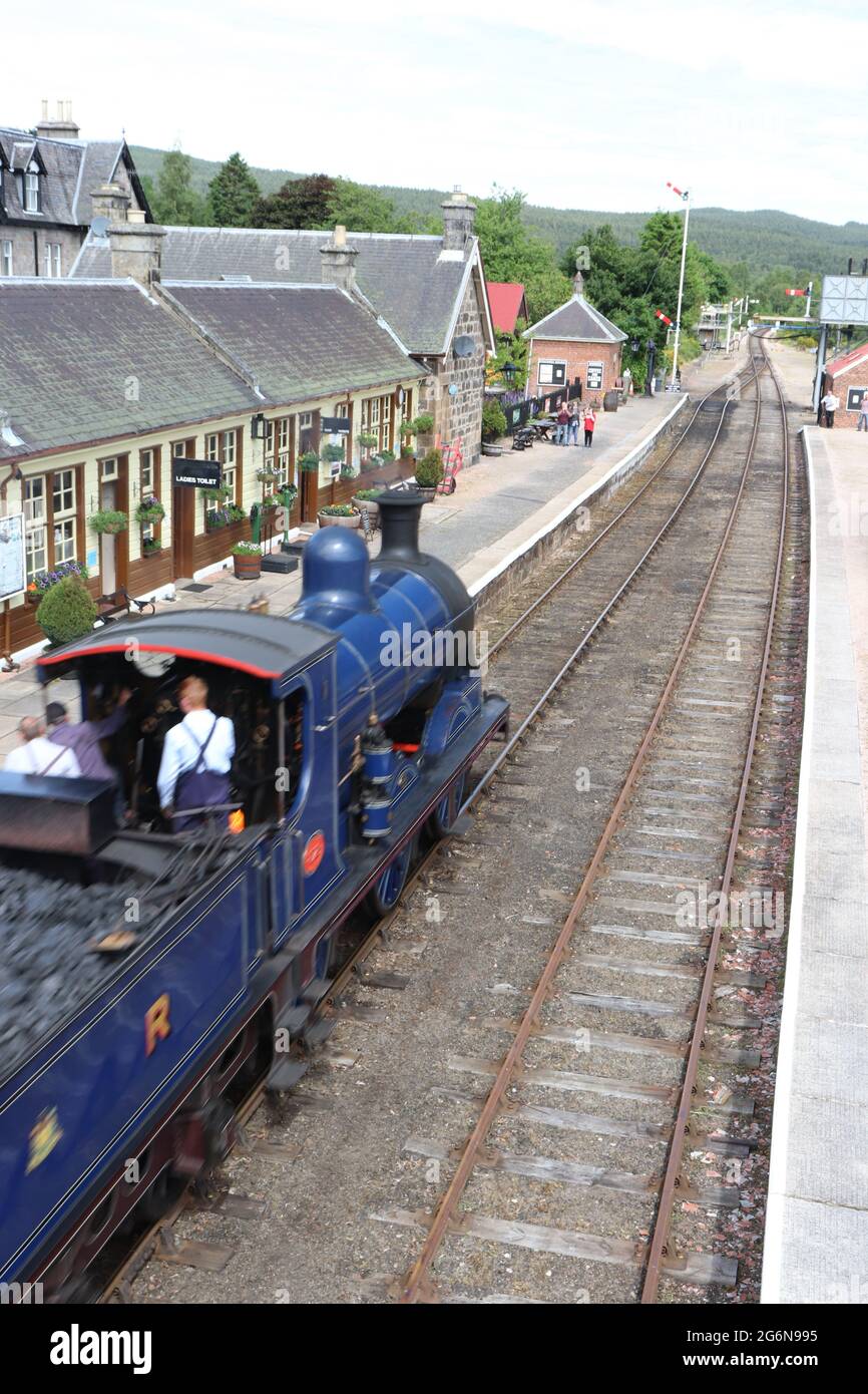 Old steam train arriving in station Stock Photo - Alamy