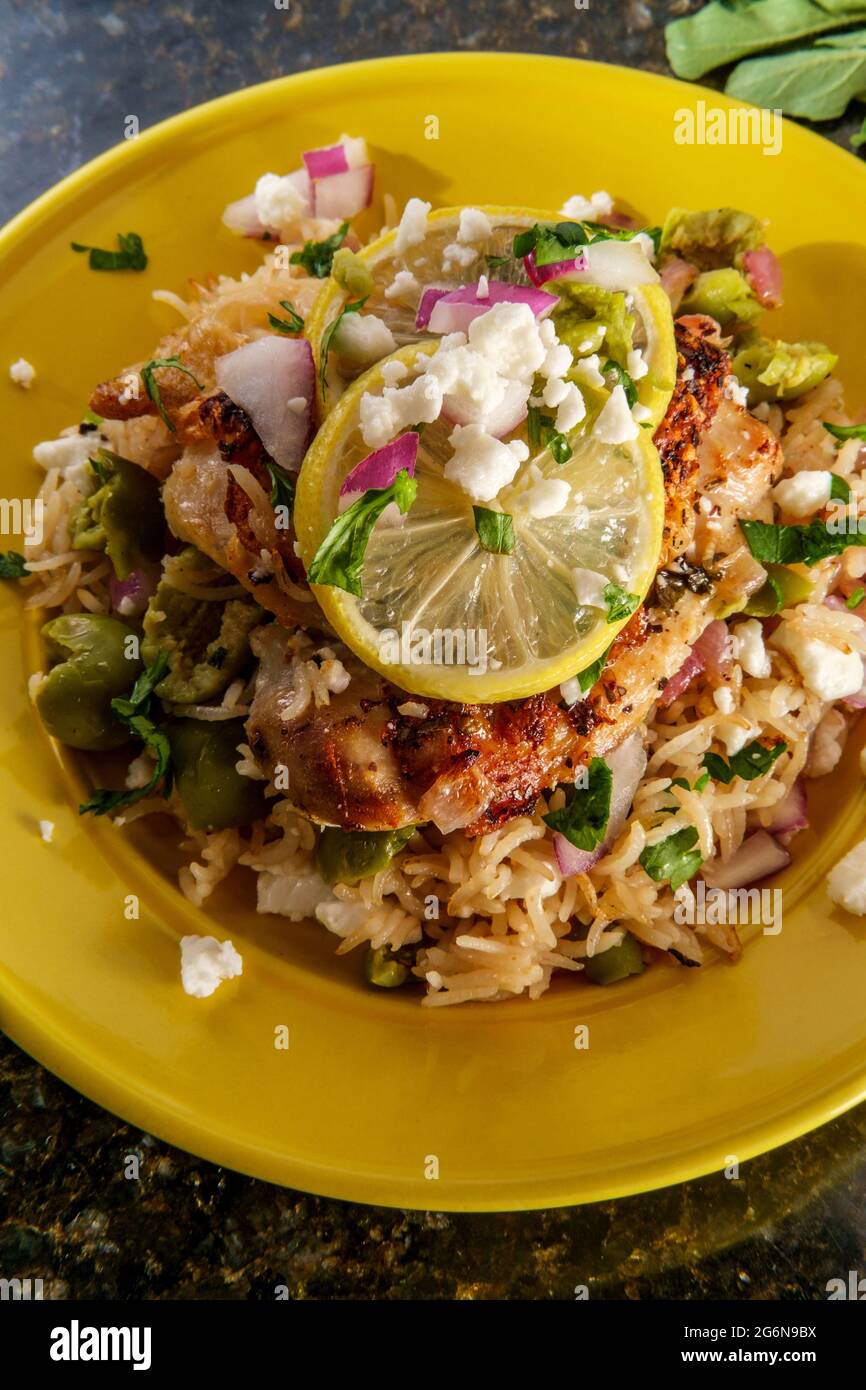 Greek skin-on bone-in crispy chicken thighs with rice and castelvetrano ...