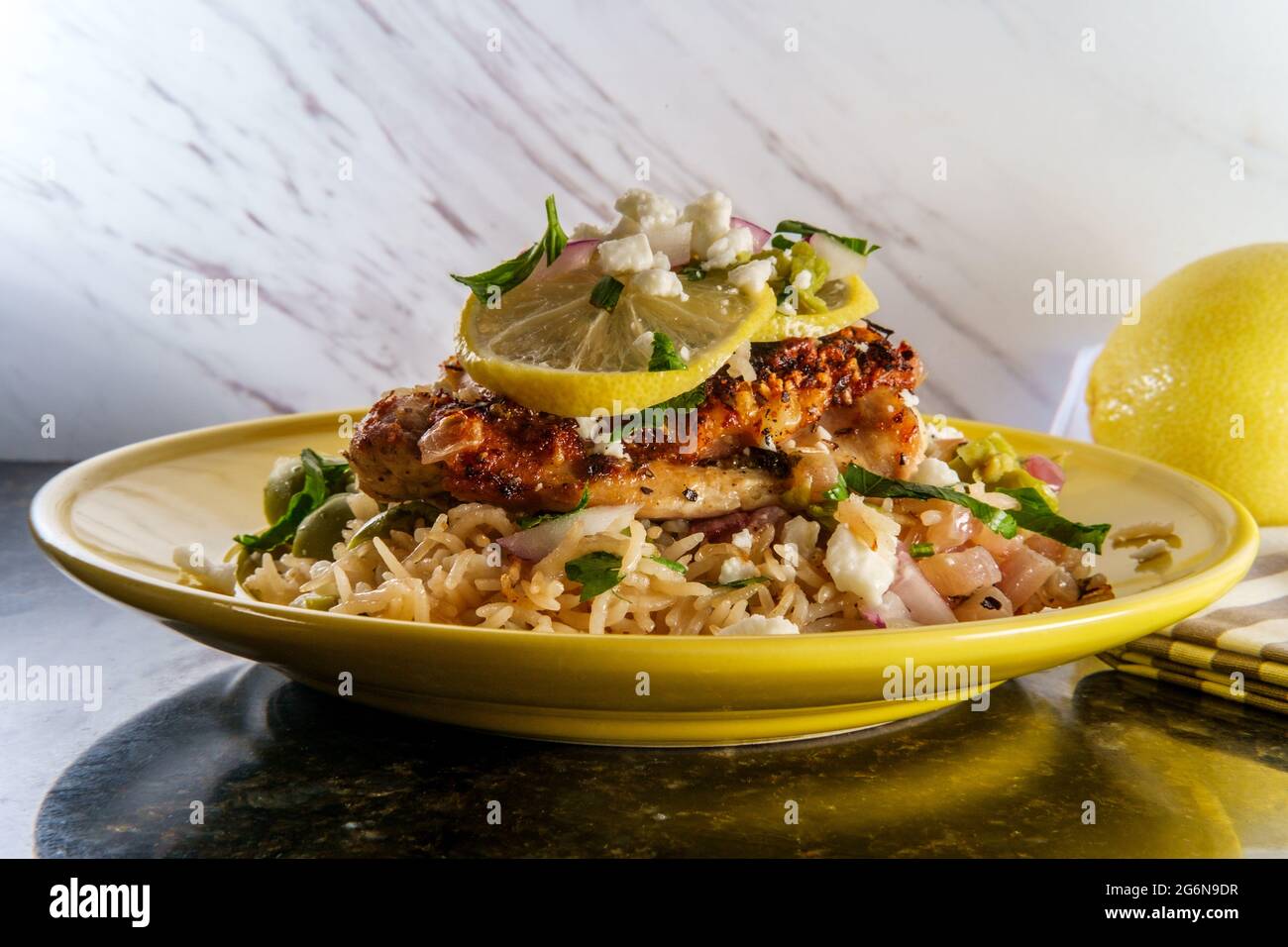 Greek skin-on bone-in crispy chicken thighs with rice and castelvetrano ...