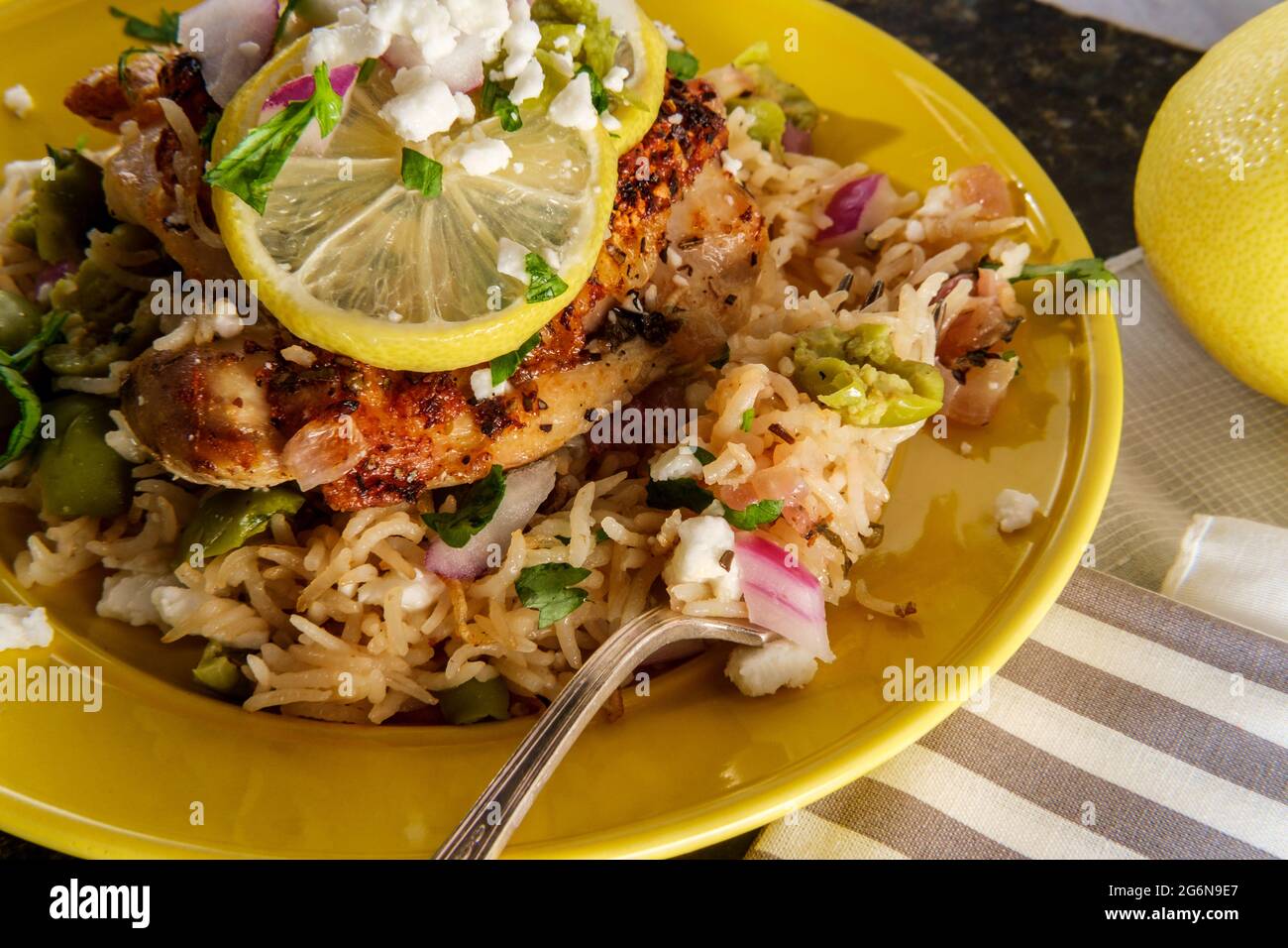 Greek skin-on bone-in crispy chicken thighs with rice and castelvetrano ...