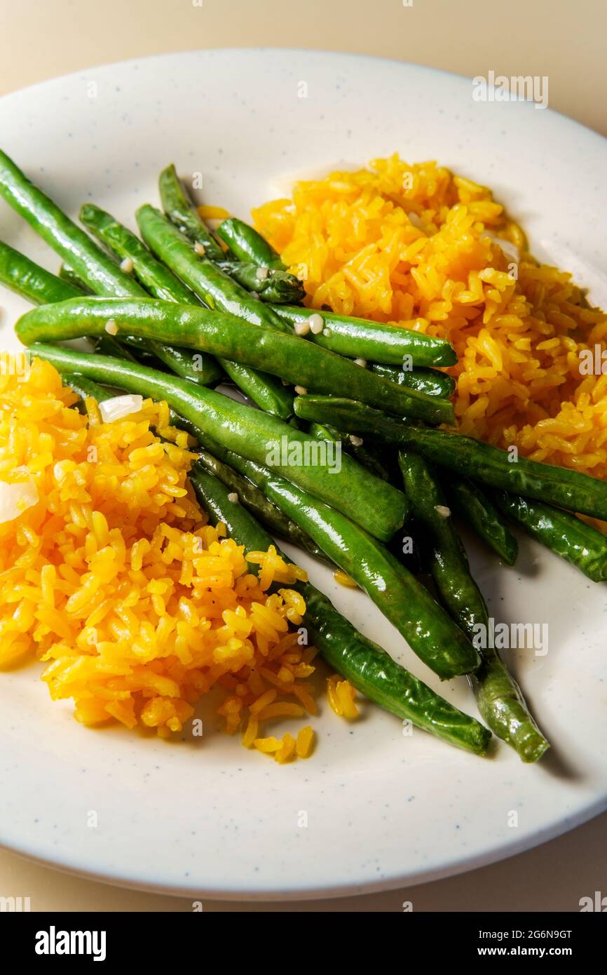 Chinese garlic string beans with yellow fried rice Stock Photo - Alamy