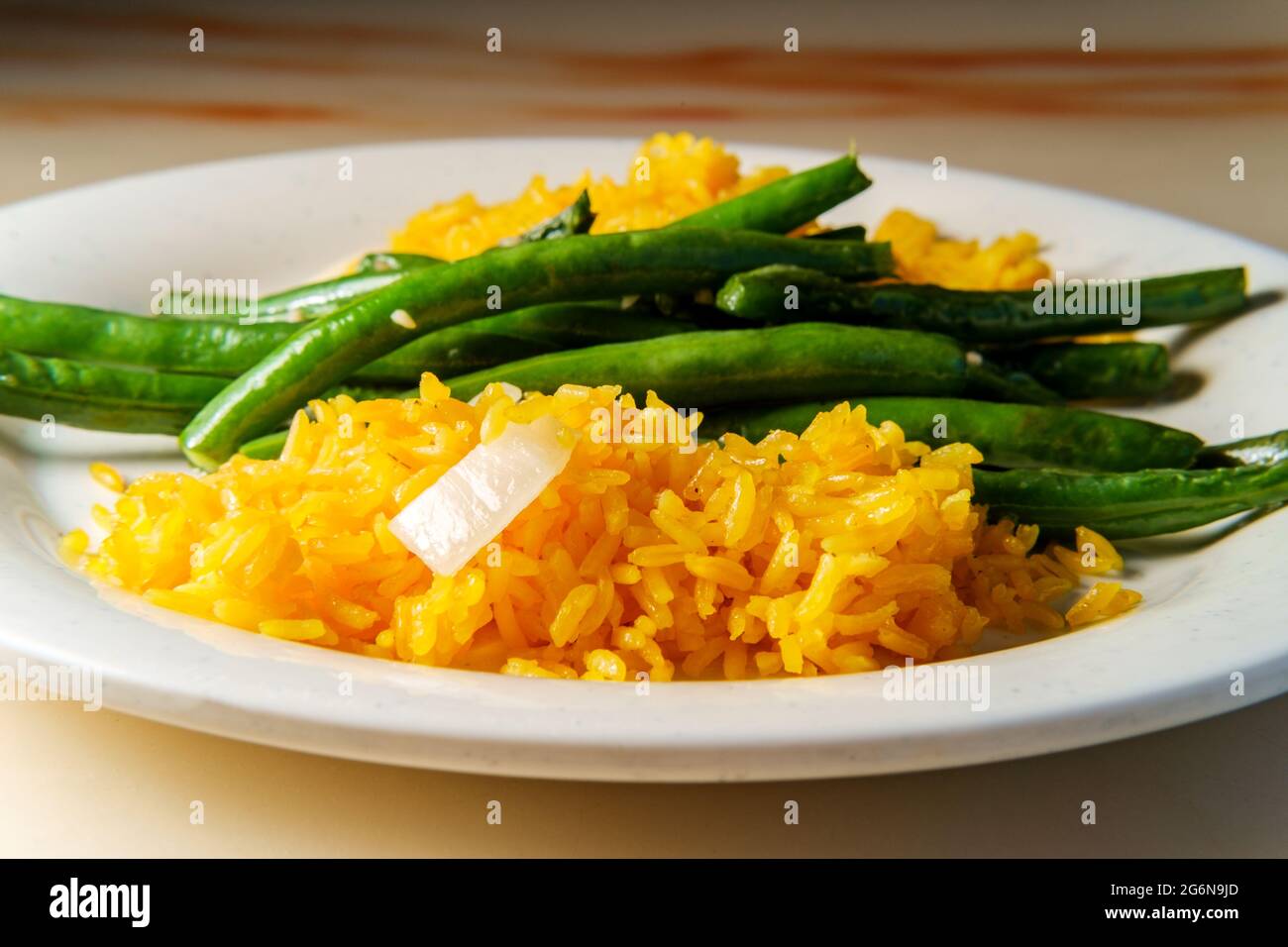 Chinese garlic string beans with yellow fried rice Stock Photo - Alamy