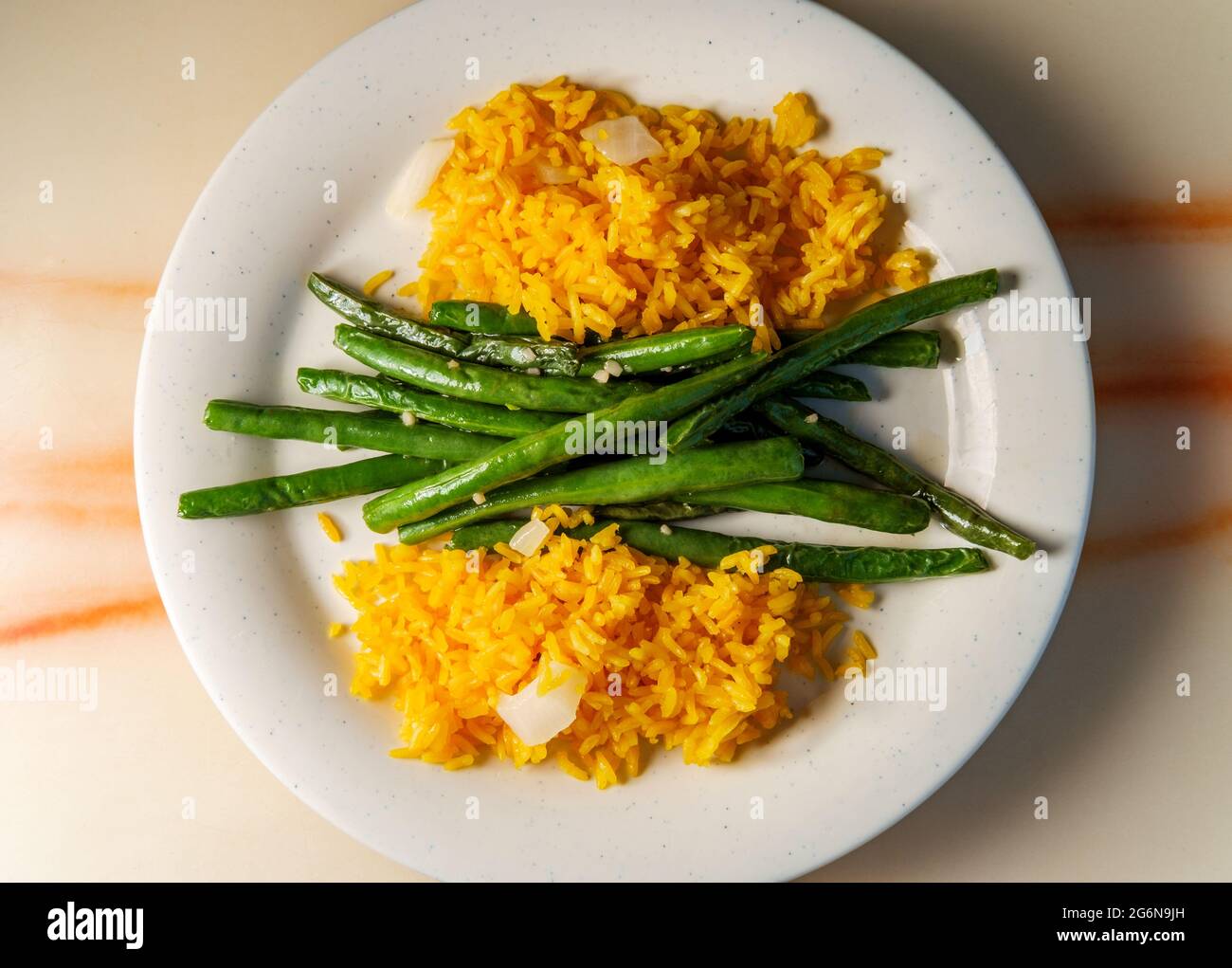 Chinese garlic string beans with yellow fried rice Stock Photo - Alamy