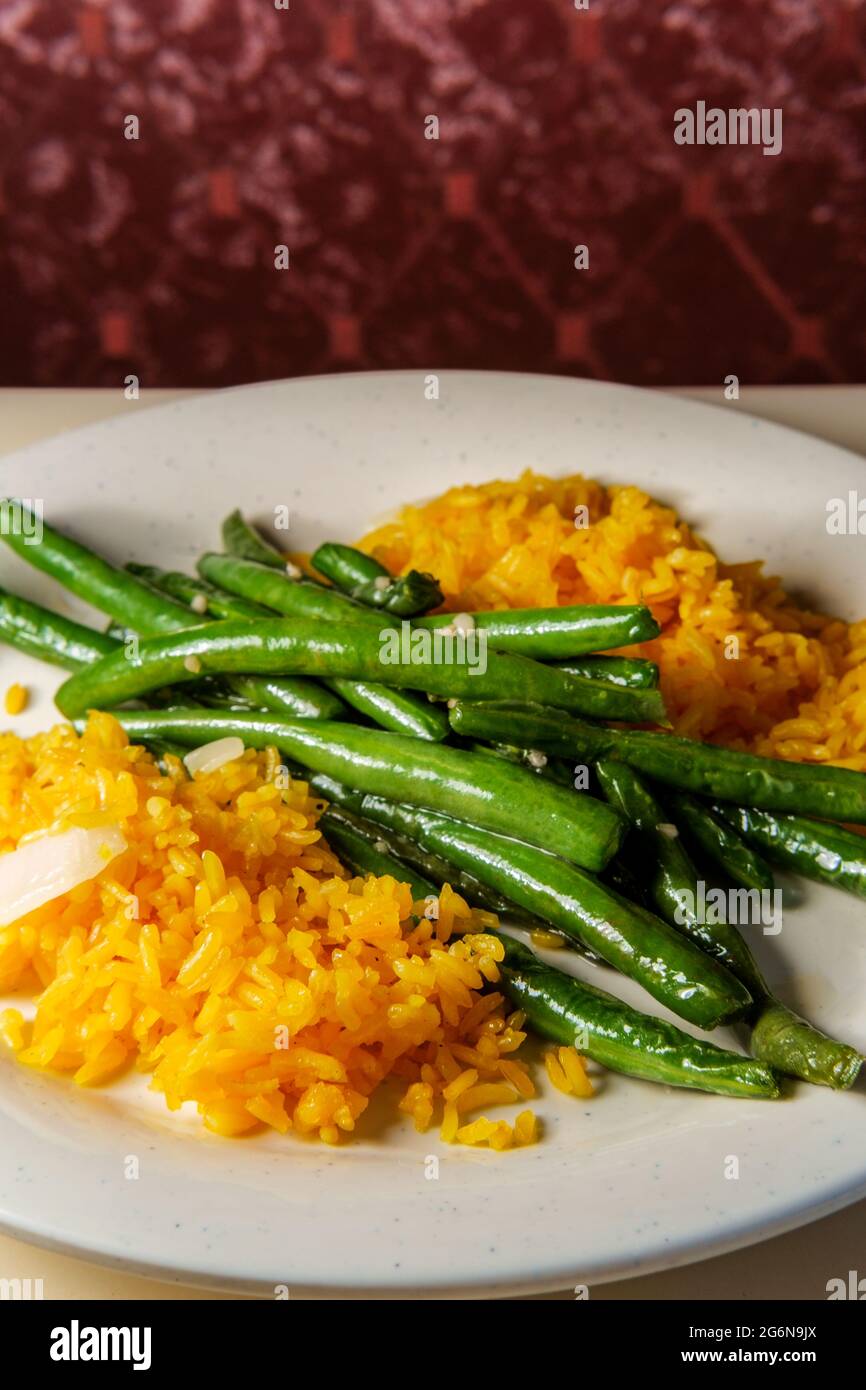 Chinese garlic string beans with yellow fried rice Stock Photo - Alamy