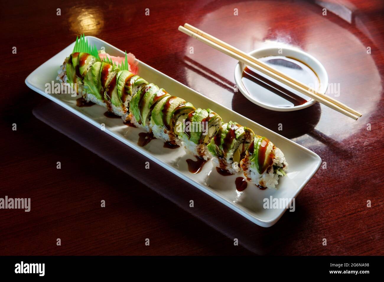 Japanese eel avacado dragon roll with wasabi and pickled ginger Stock ...