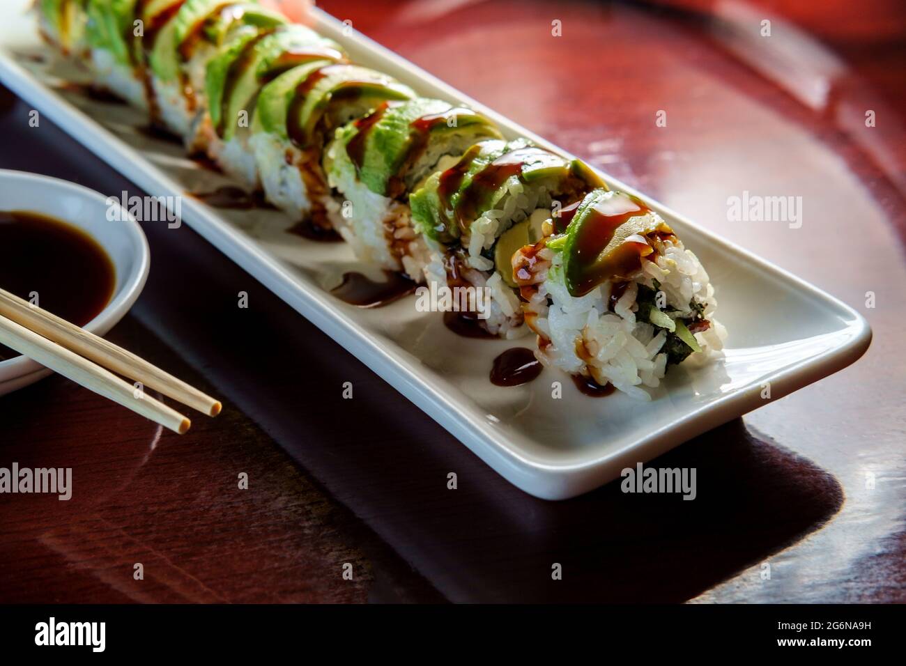 Japanese eel avacado dragon roll with wasabi and pickled ginger Stock ...