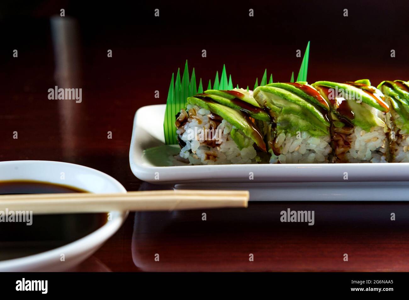 Japanese eel avacado dragon roll with wasabi and pickled ginger Stock ...