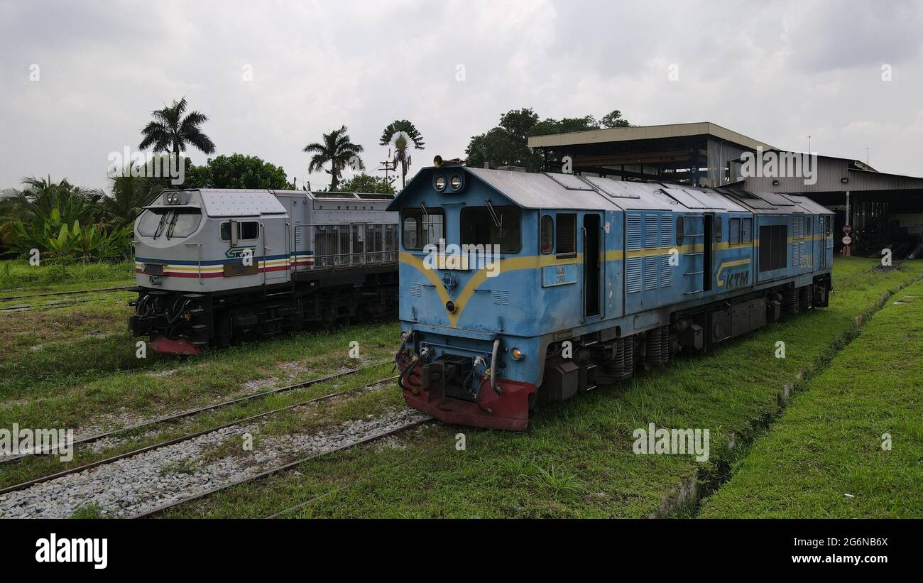 PORT KLANG, MALAYSIA- MAY 25, 2021: Two locomotives seen park side by ...