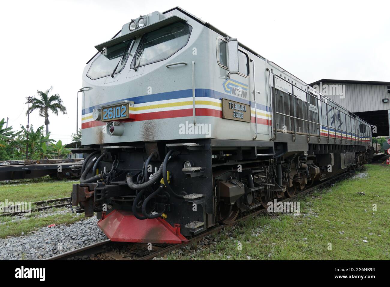 PORT KLANG, MALAYSIA- MAY 25, 2021: A locomotive is seen park in front ...