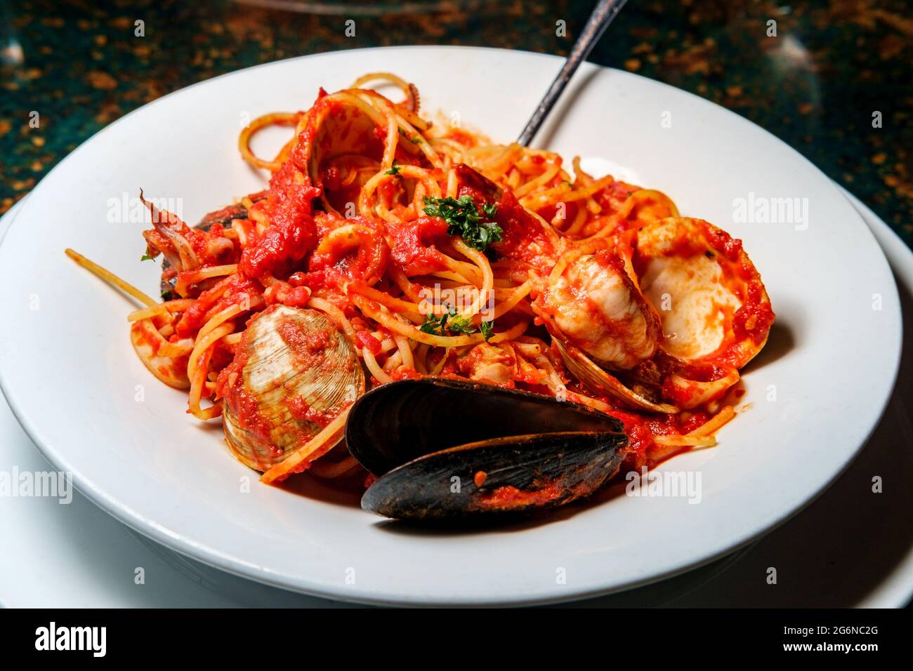 Italian seafood spaghetti pasta pescatore with mussels clams shrimp and ...