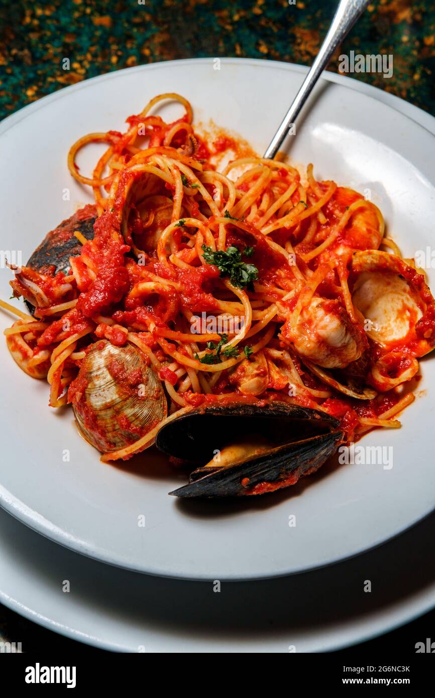Italian seafood spaghetti pasta pescatore with mussels clams shrimp and ...