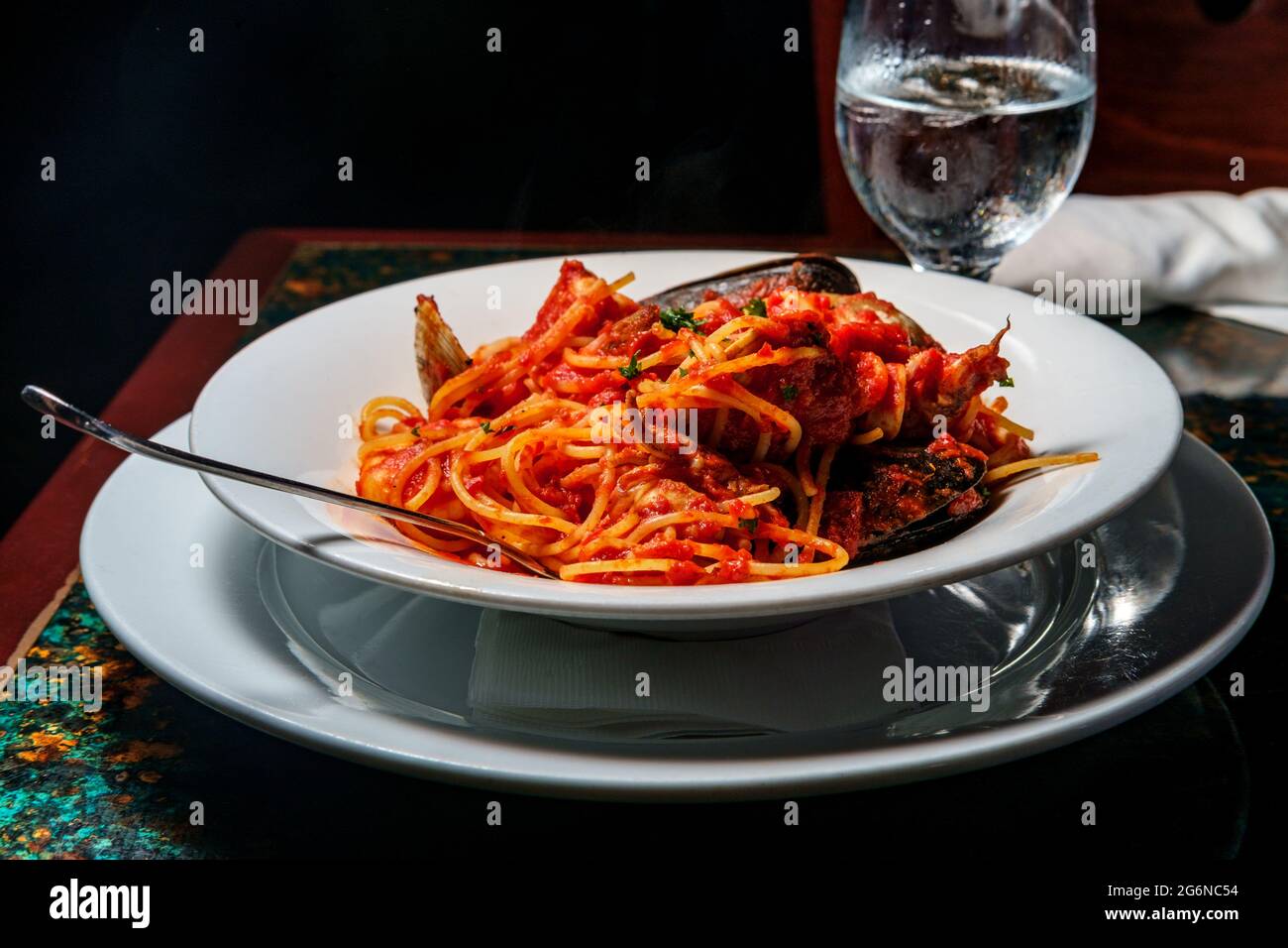 Italian seafood spaghetti pasta pescatore with mussels clams shrimp and ...