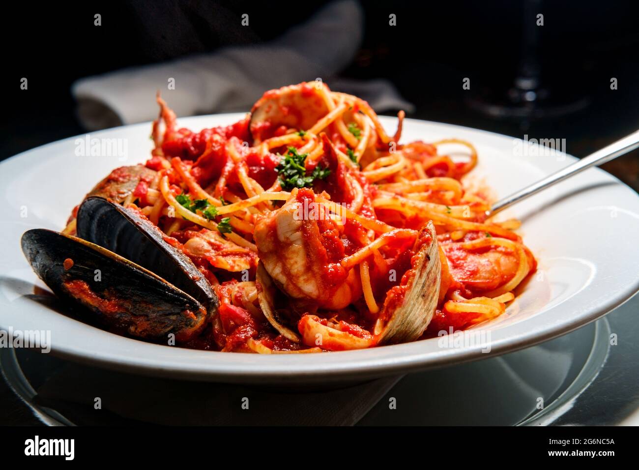 Italian seafood spaghetti pasta pescatore with mussels clams shrimp and ...