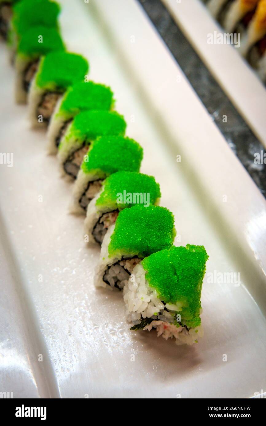 Various sushi buffet rolls at self serve station Stock Photo - Alamy