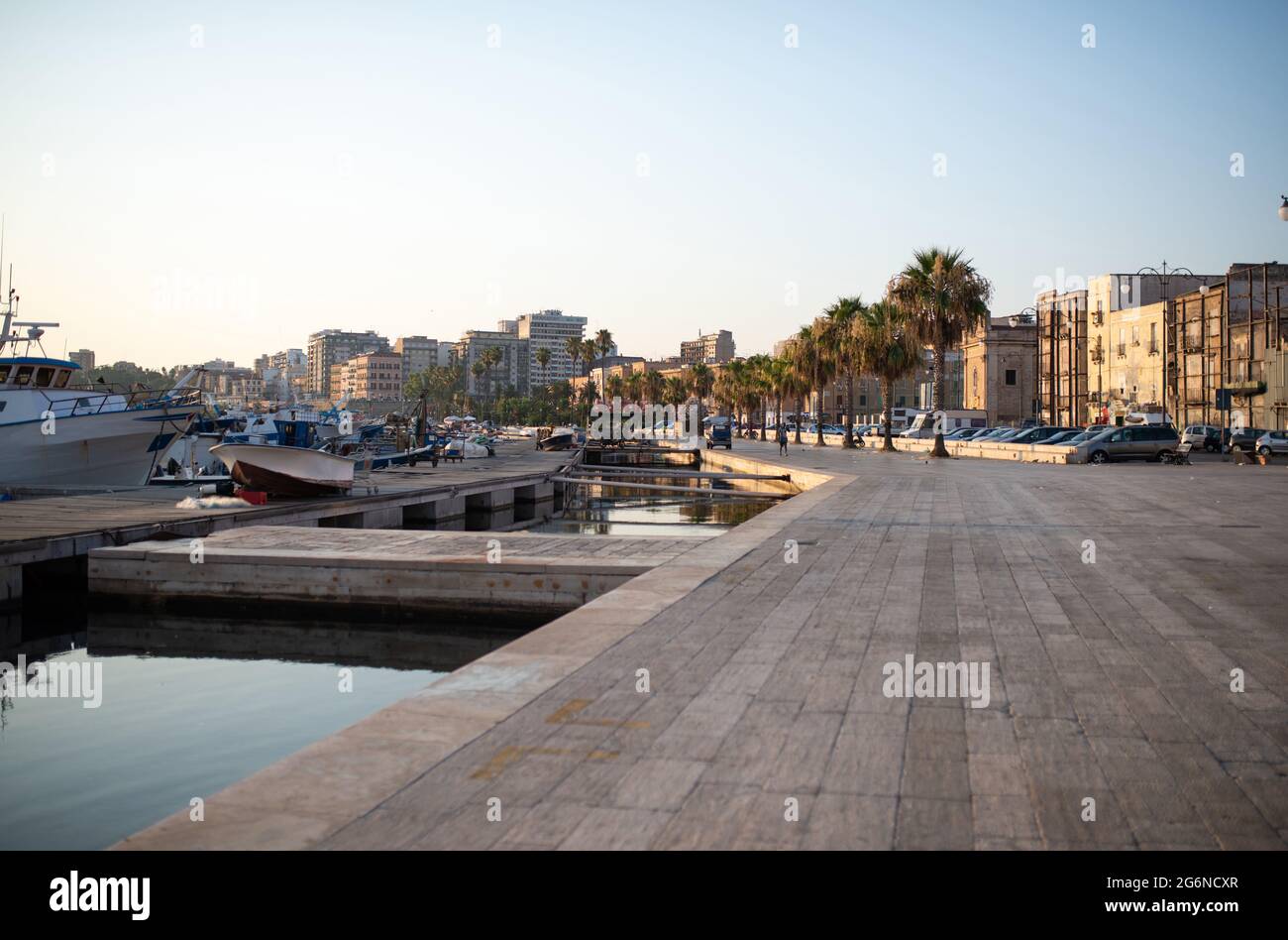 Sea port. Ships and boats at dawn. Sea town. Taranto Stock Photo - Alamy