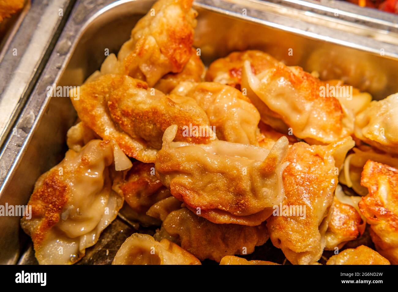Buffet tray of fried Asian potsticker pork dumplings Stock Photo - Alamy