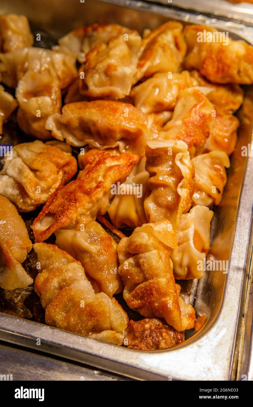 Buffet tray of fried Asian potsticker pork dumplings Stock Photo - Alamy