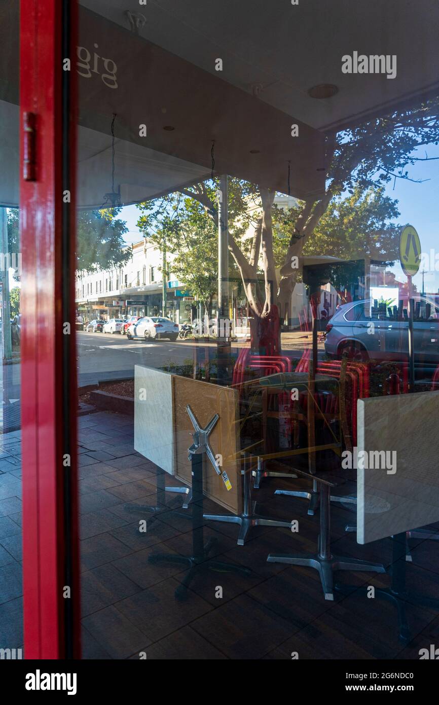Reflections in windows of closed bar, in Balmain, Sydney Australia ...