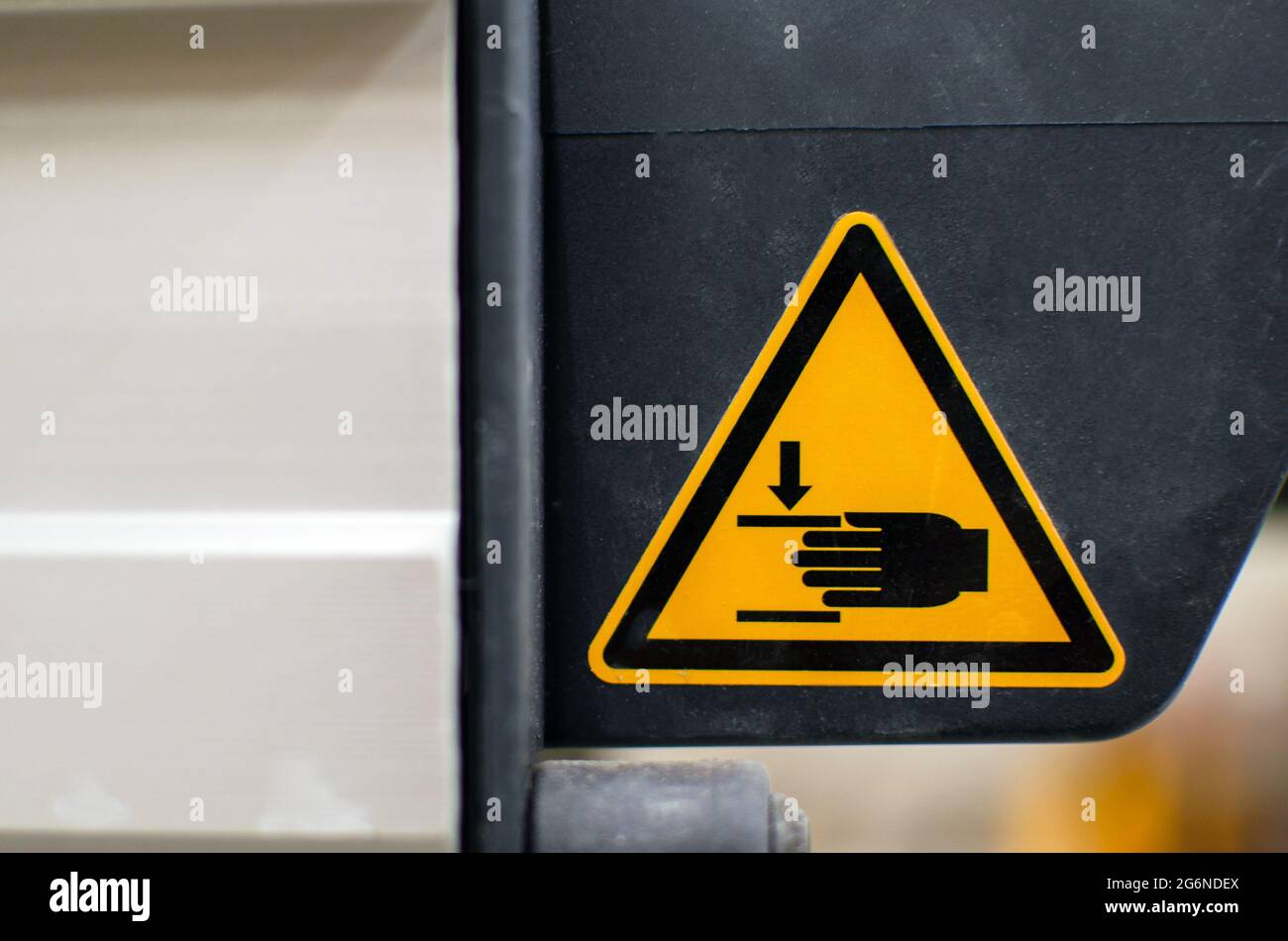 Warning sign on agricultural machinery. Do not put your hands out ...