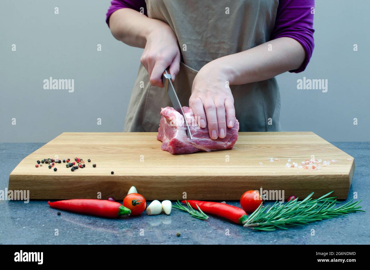 Chef Butcher cutting pork meat with knife on kitchen, cooking food ...