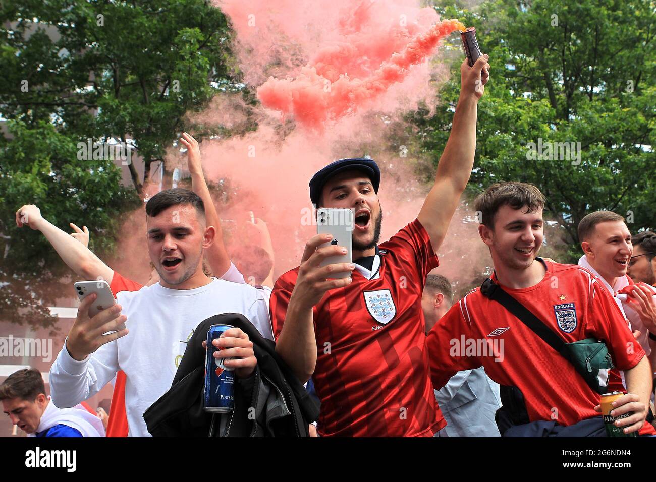 London, UK. 07th July, 2021. England fans set off a flair outside the ...