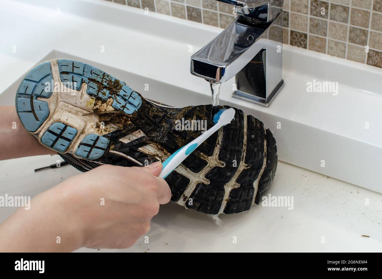 Cleaning dirty sneakers after training. Wash dirty sneakers. Wash your ...
