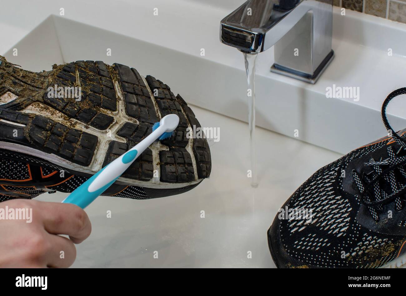 Cleaning dirty sneakers after training. Wash dirty sneakers. Wash your ...