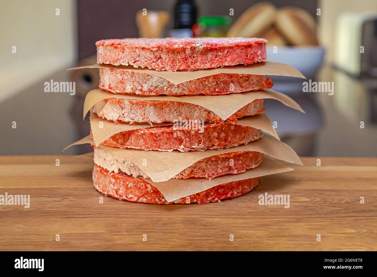 Frozen burger meat on table before grilling, defrost before grilling ...
