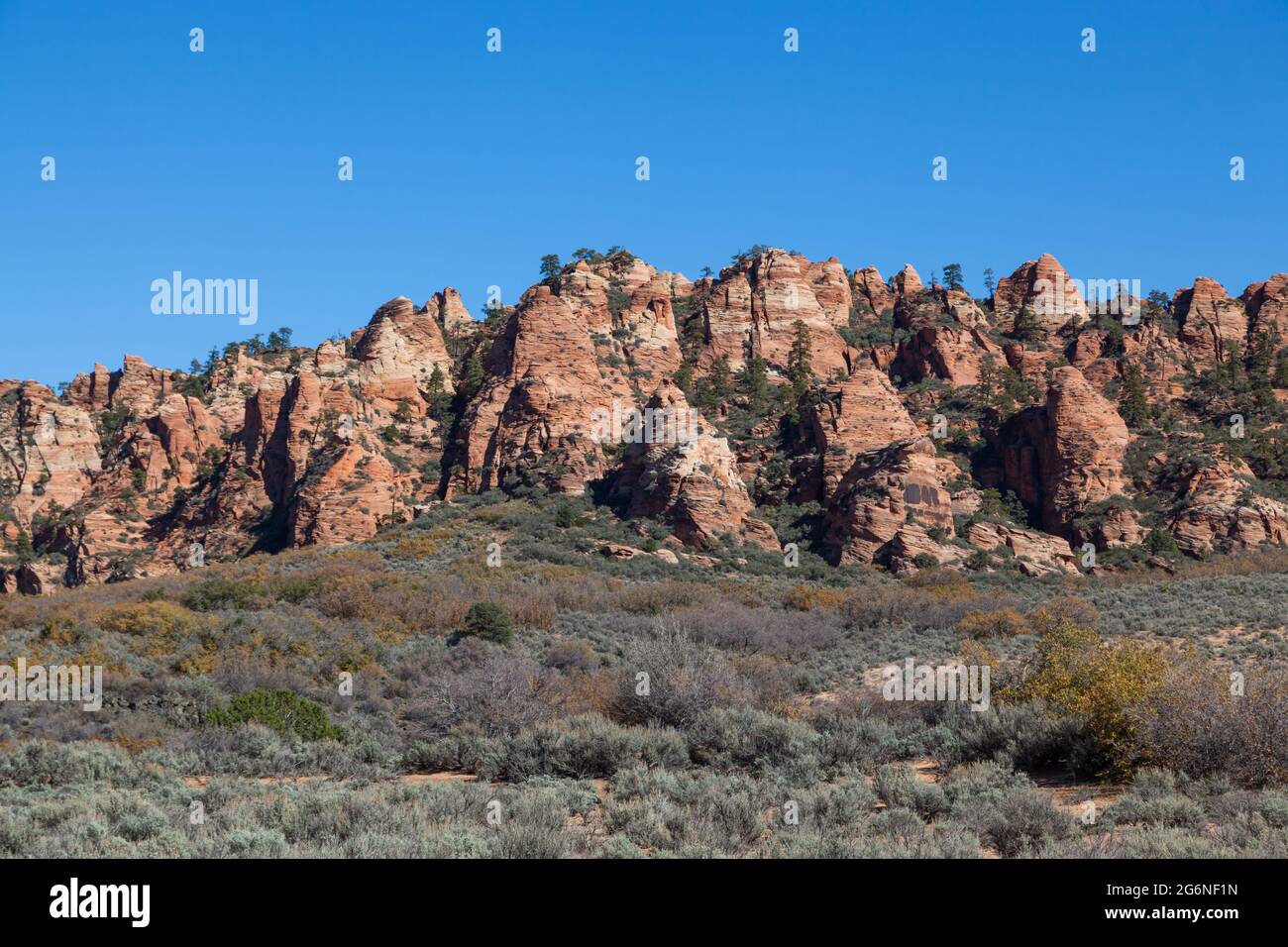 A ridge of red layered sandstone that has been eroded over time to ...