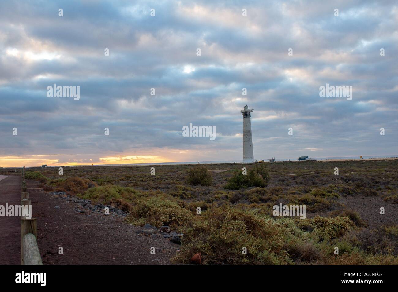 Tall lighthouse on a meadow Stock Photo - Alamy