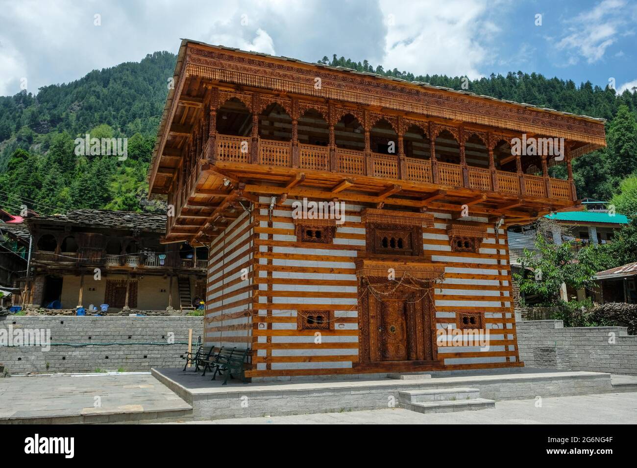 Manali, India - June 2021: Hindu temple and traditional houses in the ...