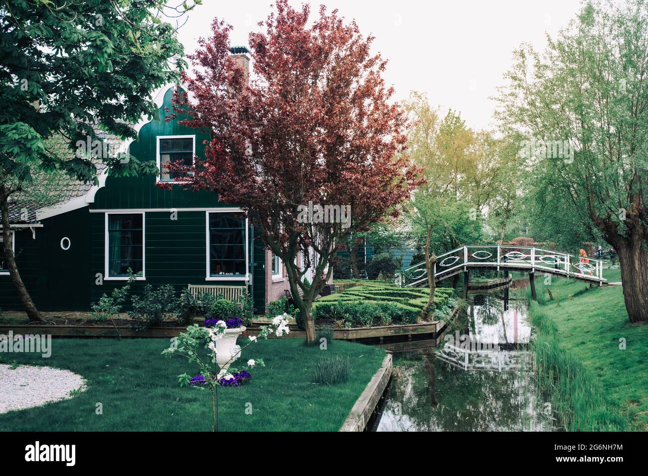 Courtyard of rural house building with grass and trees Stock Photo - Alamy
