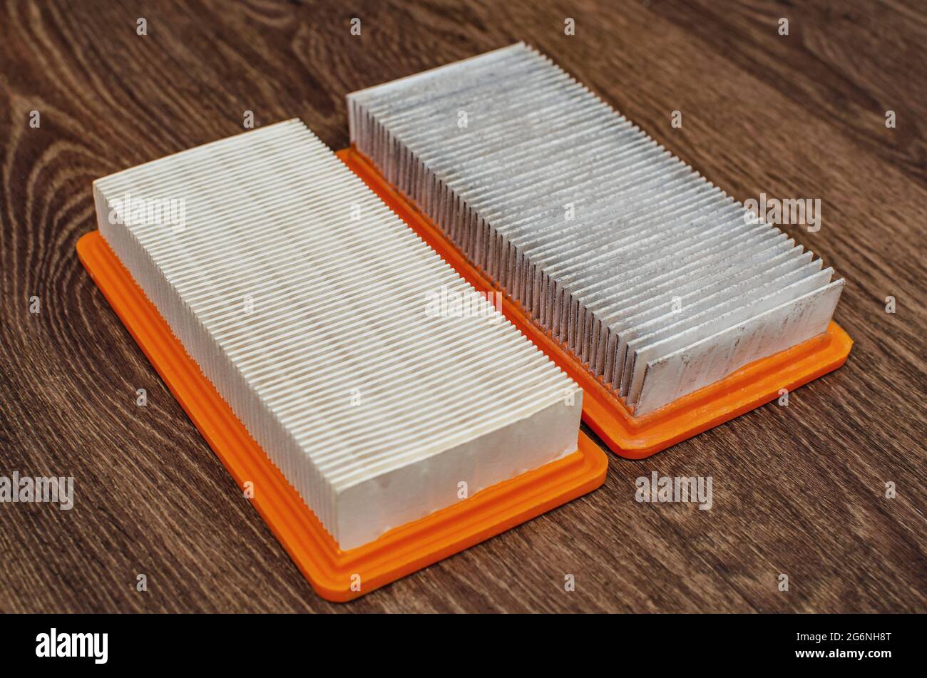 Old and new filters for a vacuum cleaner Stock Photo - Alamy