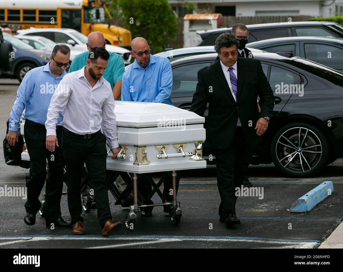 Pallbearers wheel the casket of Anaely Rodriguez as they arrive to her ...