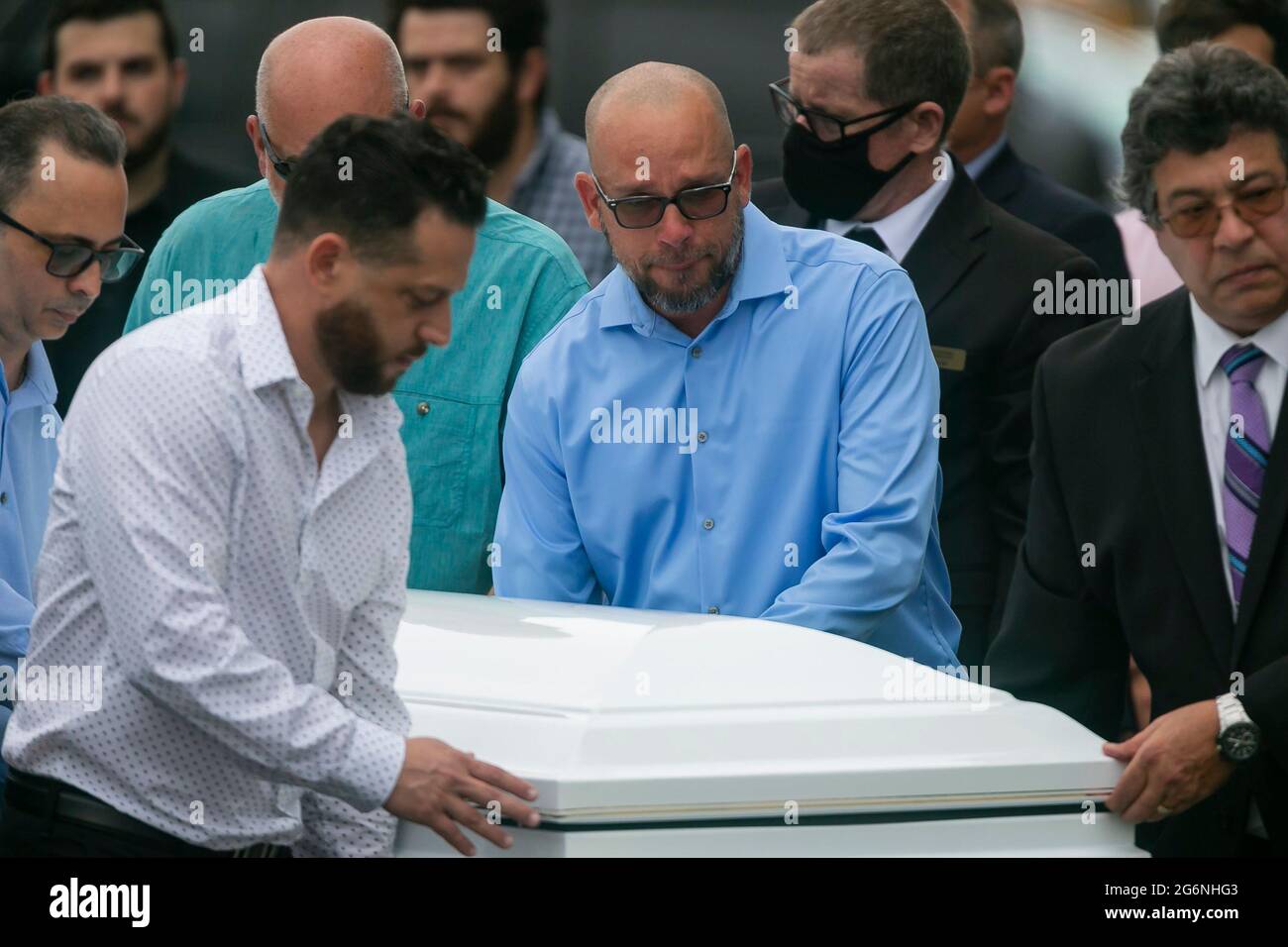 Pallbearers wheel the casket of Anaely Rodriguez as they arrive to her ...