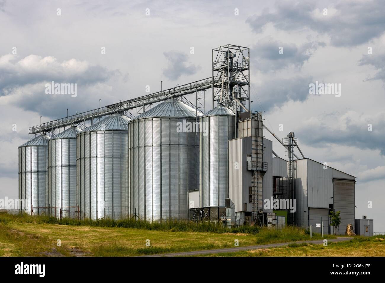 Farm silo for storing cereals in the countryside Stock Photo - Alamy