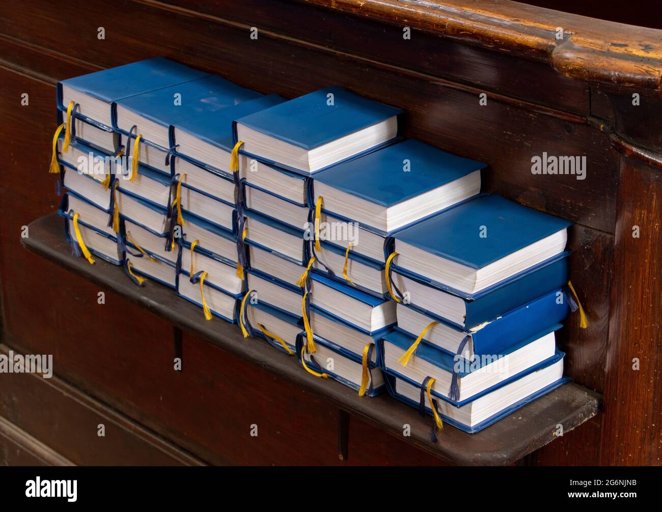 A stacks of books for prayer and religious sing on the shelf in the ...