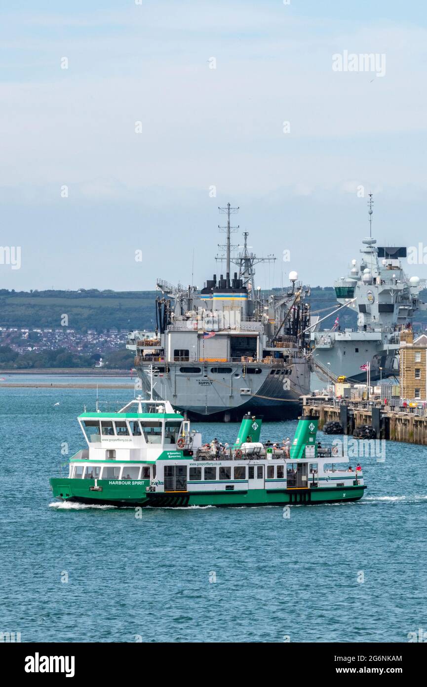 gosport ferry crossing portsmouth harbour in front of aircraft carrier ...