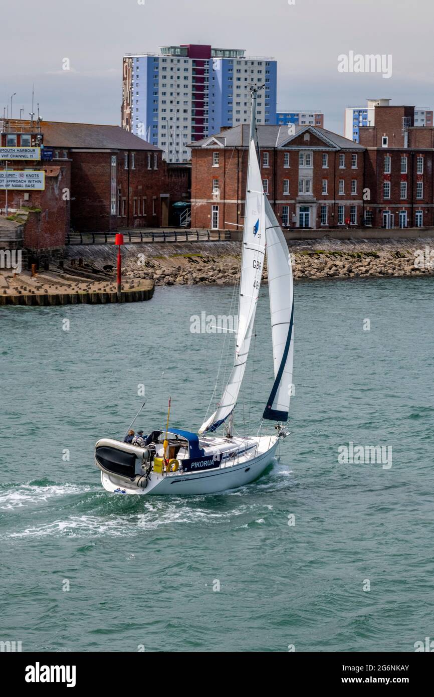 a cruising yacht entering portsmouth harbour under full sail sailing ...