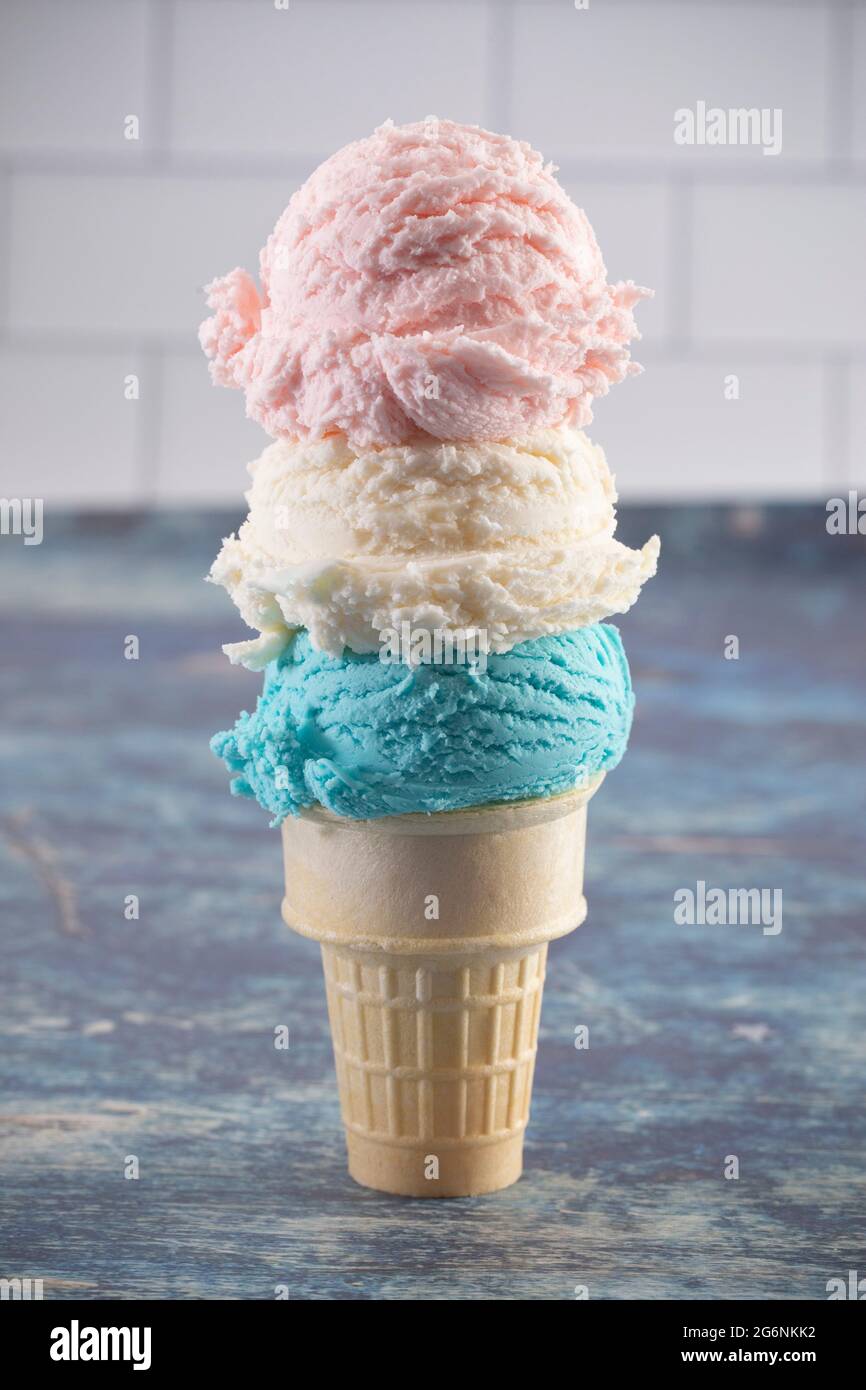Red White and Blue Scoops of Ice Cream on a Cone on a Rustic Table ...