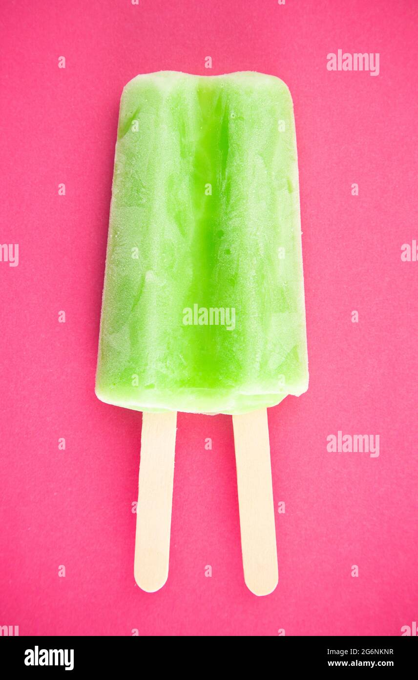 Green Popsicle on a Bright Pink Background Stock Photo - Alamy
