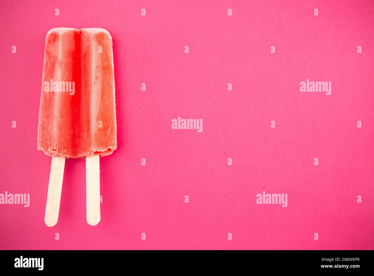 Red Popsicle on a Bright Pink Background Stock Photo - Alamy