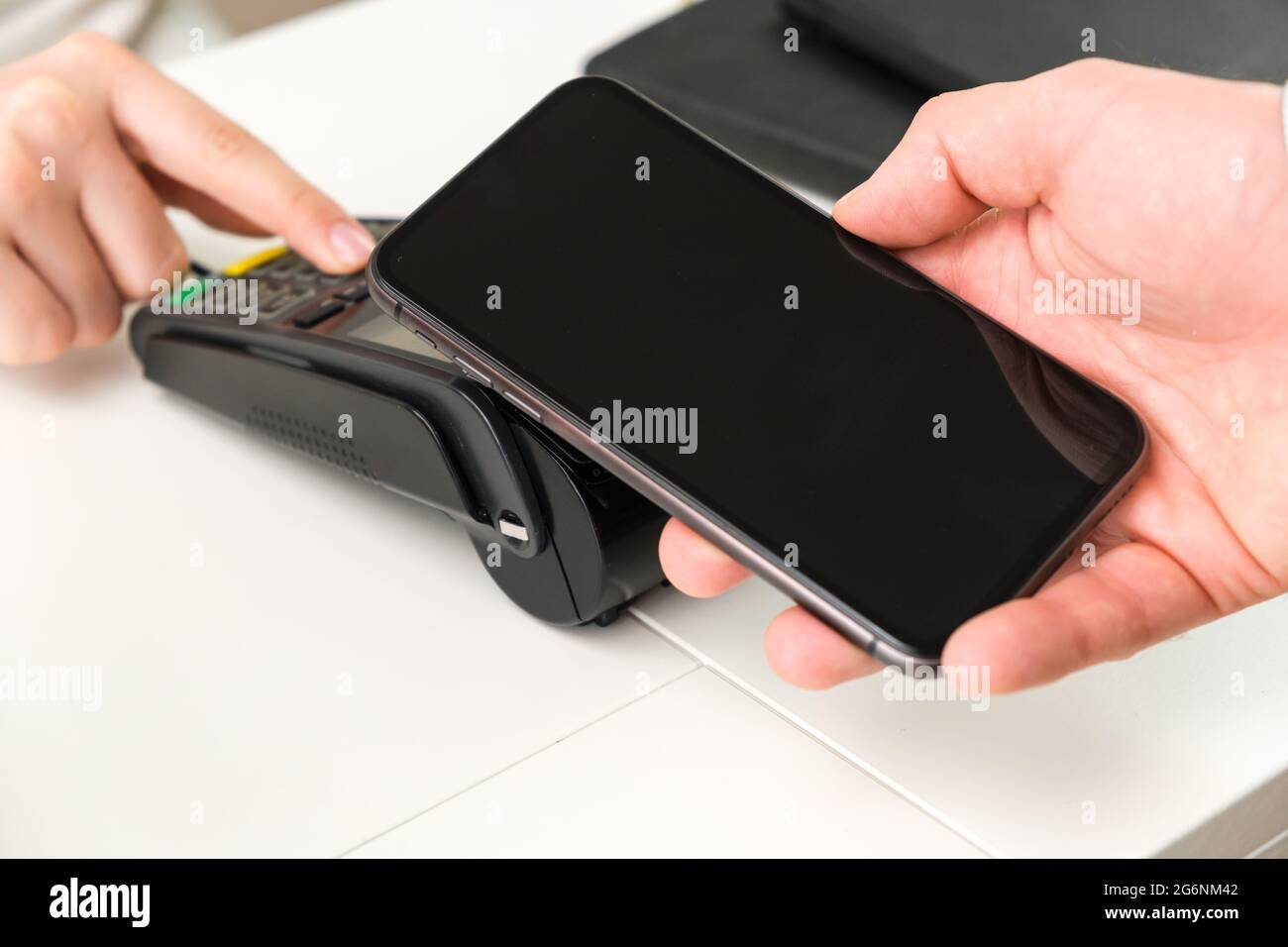 Contactless payment using smartphone by POS payment terminal Stock ...