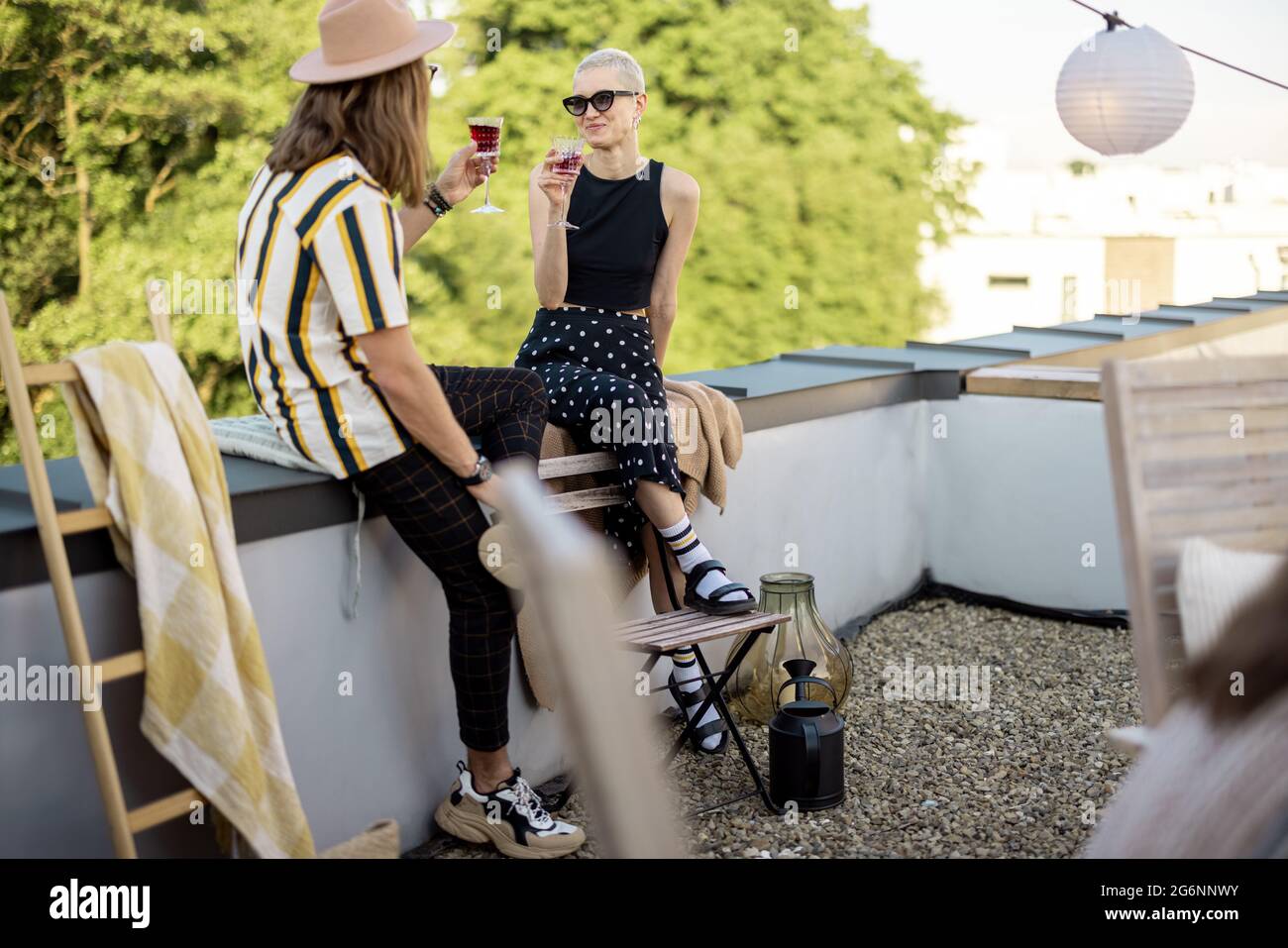 Two friends hanging out at picnic outdoors Stock Photo - Alamy Two friends hanging out at picnic outdoors Stock Photo - Alamy